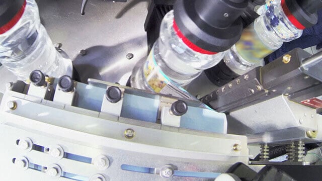 Flexible wrap-around labeling with hot melt adhesive | Robatech